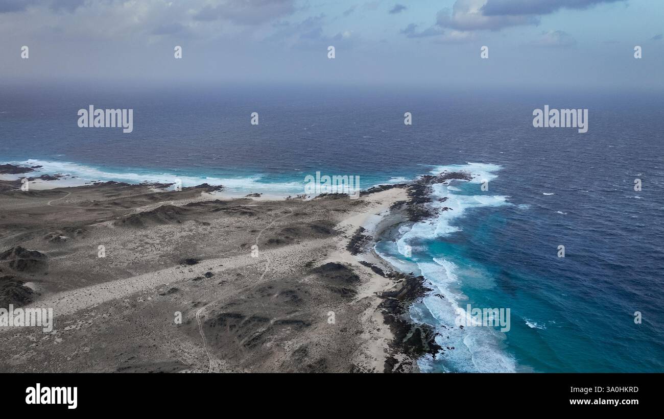 Vast sandy plains meet the azure waters of the Indian Ocean, showcasing ...