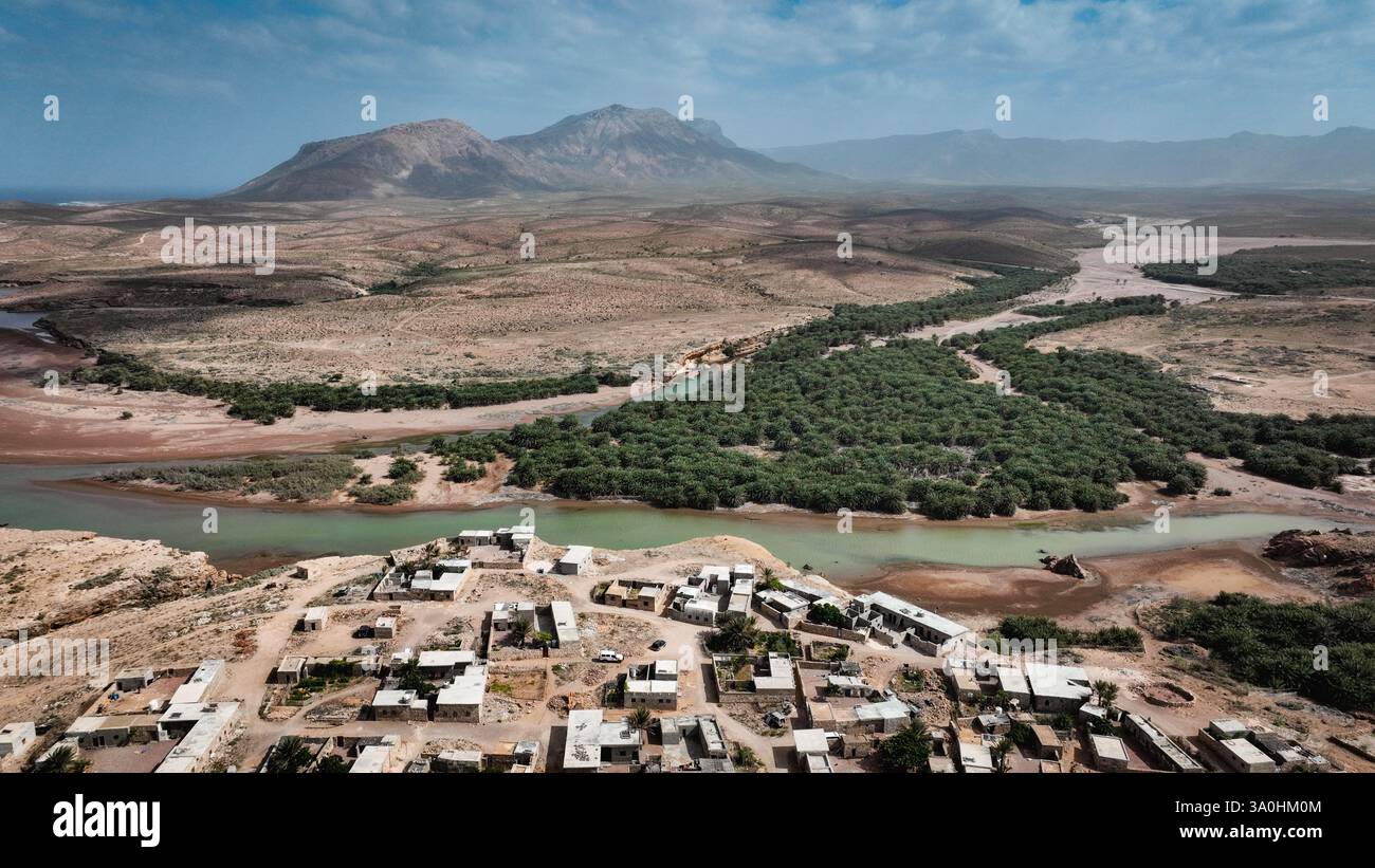 Expansive view of Socotras arid landscape features lush greenery along ...