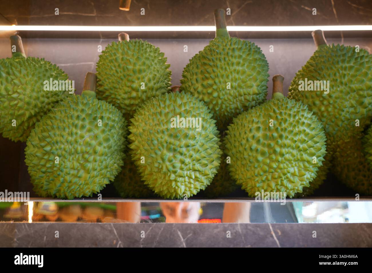 Spiky durian fruit at a market in Singapore Stock Photo - Alamy
