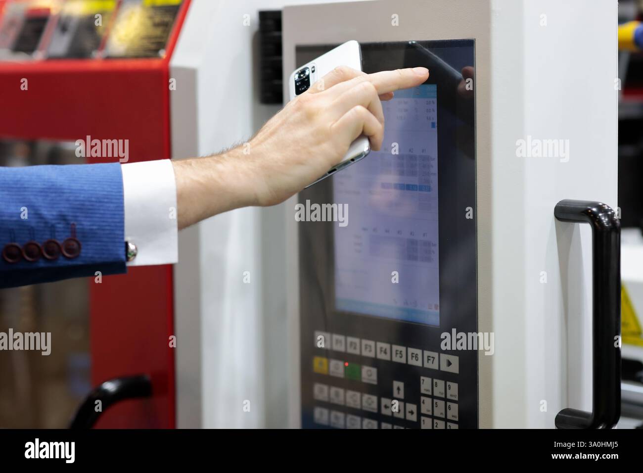 Working with industrial touch screen control panel. Selective focus ...