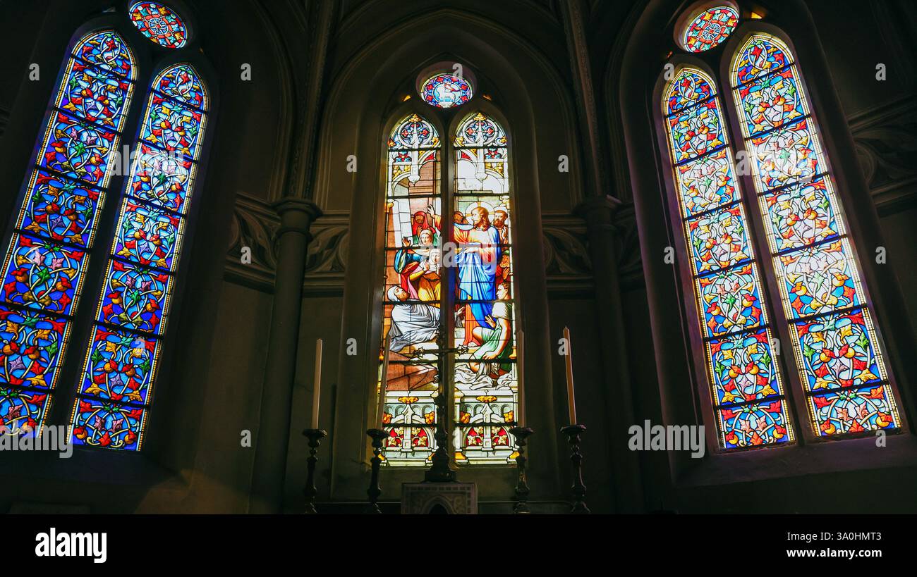 Colorful stained glass windows adorn the walls of a historic church in ...