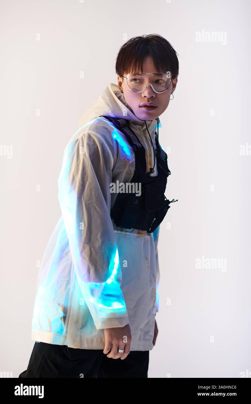 A confident young Asian man models contemporary fashion trends in a ...