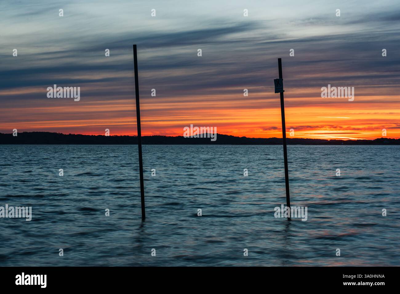 Sunset casts stunning colors over the coastal waters outside Gothenburg ...