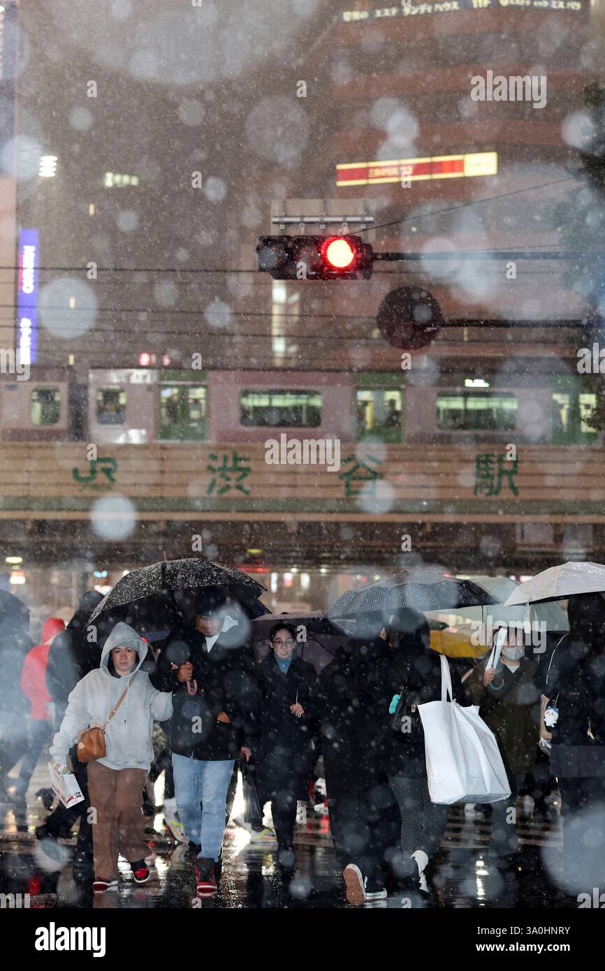 People walk in snow in Shibuya, Tokyo on March 4, 2025.( The Yomiuri ...