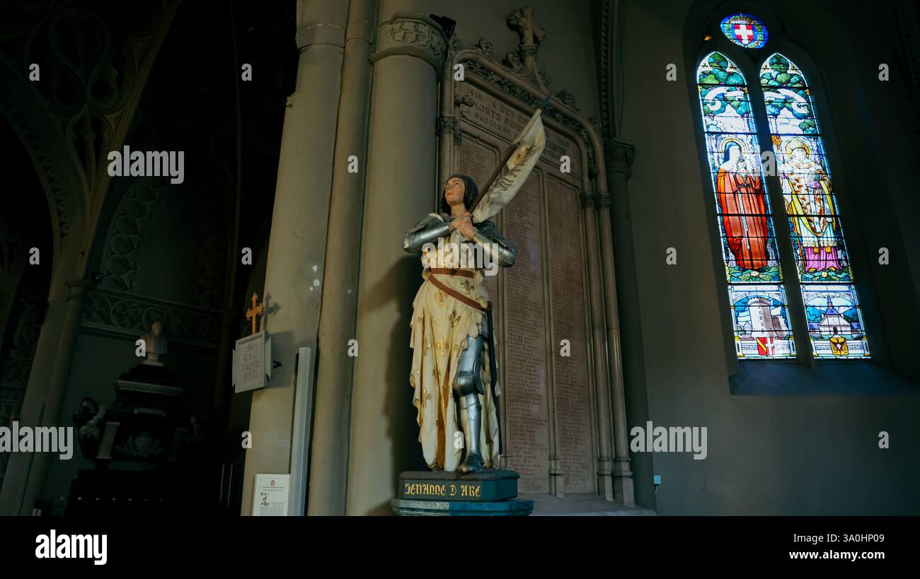 A detailed statue of Saint Michael stands inside the Church of Saint ...