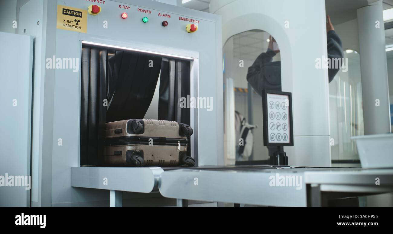 Airport Security Checkpoint: Security Officer Putting Suitcases and ...