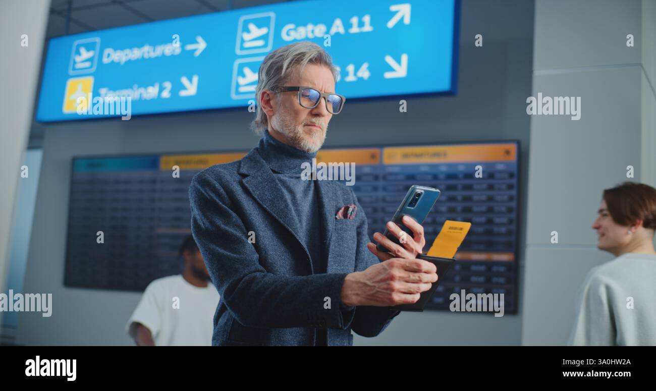 Airport Terminal: Mature Man Scanning Plane Ticket Using Smartphone to ...