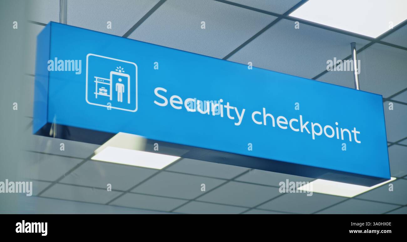 Modern International Airport Terminal: Big LED Blue Security Checkpoint Sign Hanging on Ceiling ...