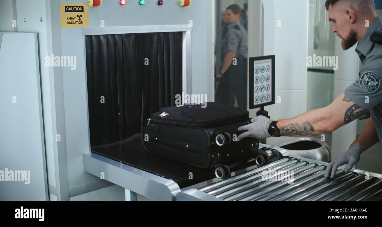 Screening Procedures at Airport Security Checkpoint: TSA Worker Puts ...