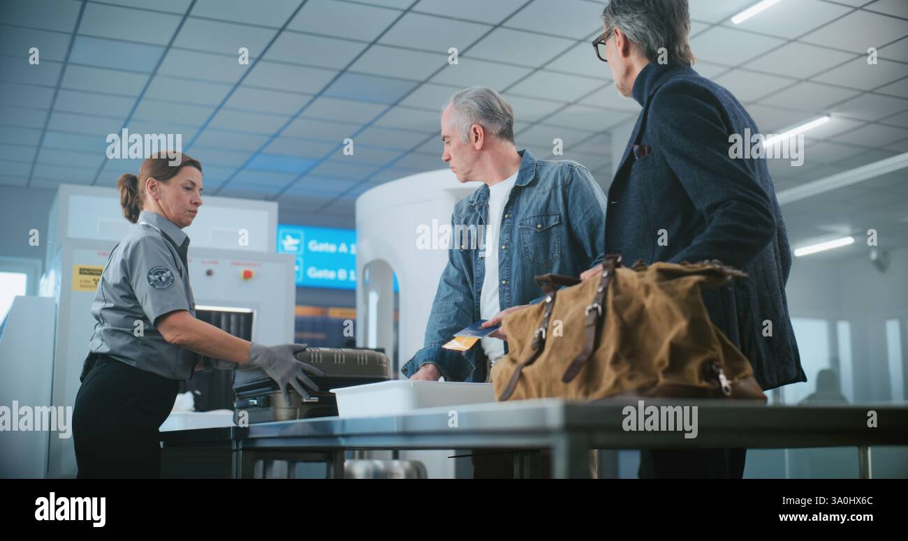 Security Checkpoint in Airport: Female TSA Worker Takes Bags, Personal ...