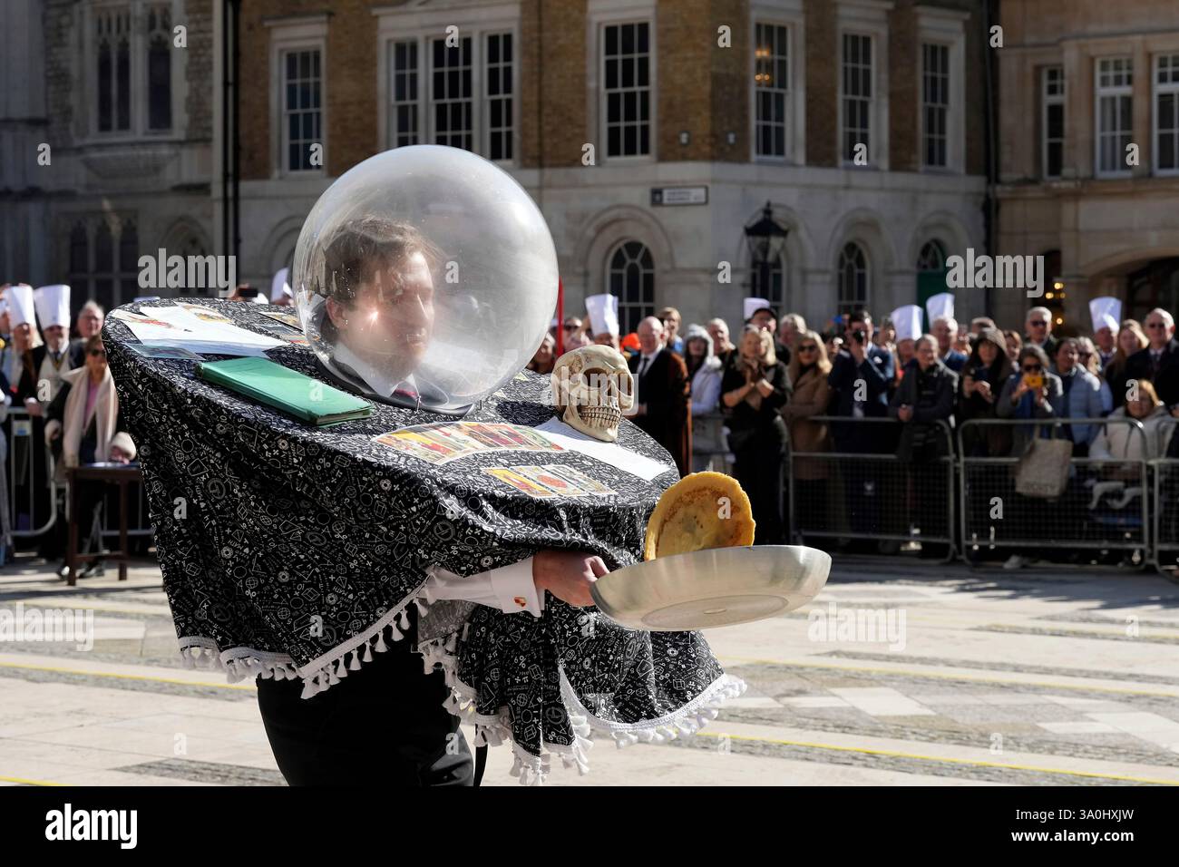 A runner competes during a traditional pancake race by livery companies ...
