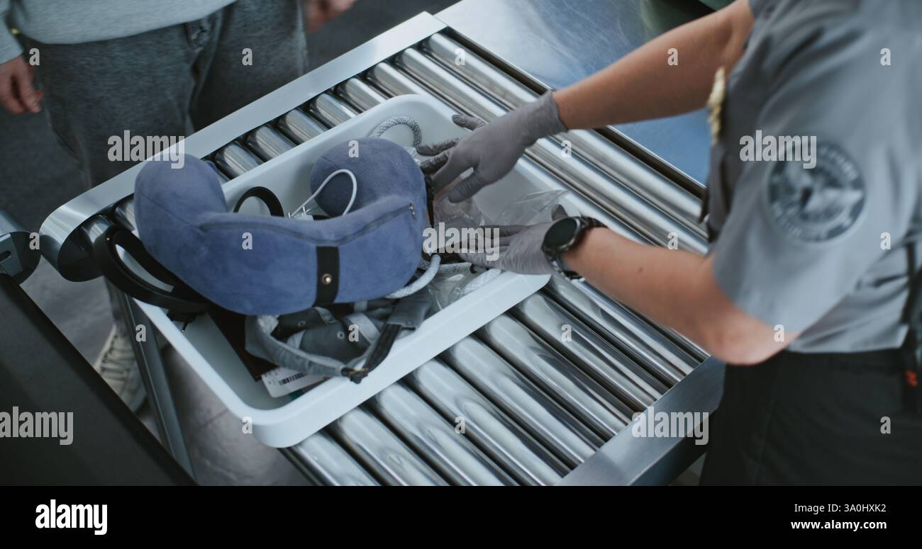 Security Checkpoint in International Airport Terminal: TSA Worker ...