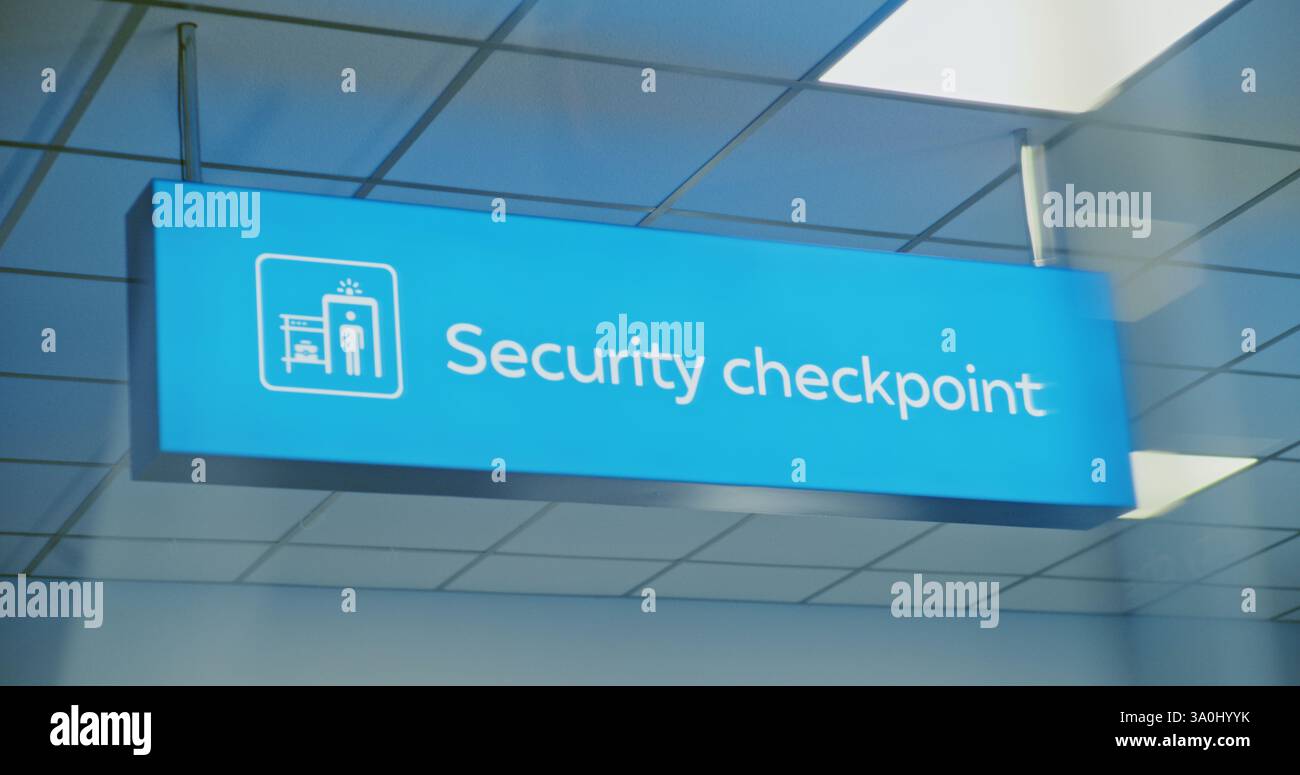 Modern International Airport Terminal: Big LED Blue Security Checkpoint Sign Hanging on Ceiling ...