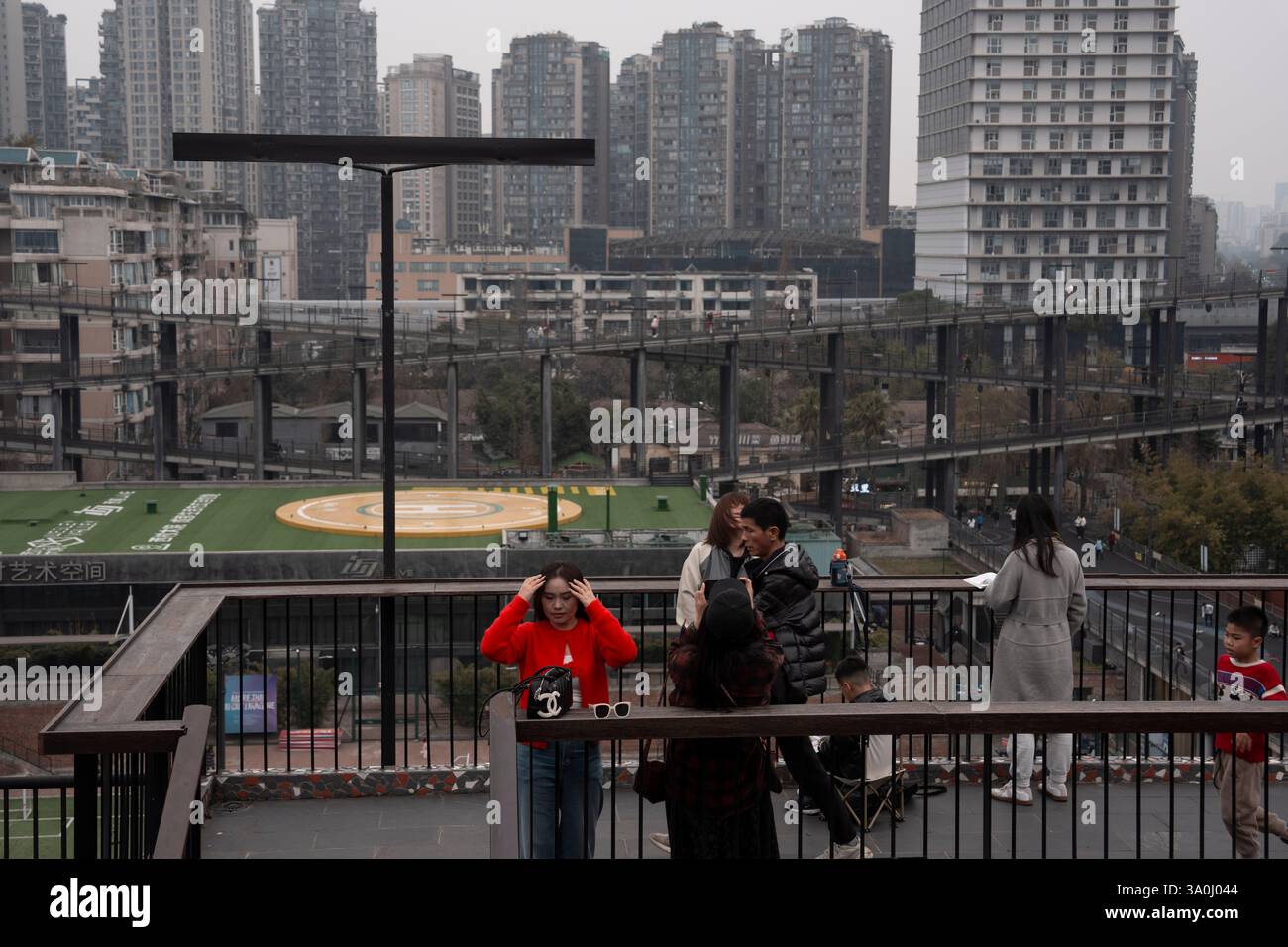 Visitors take in the sight at the West Village project by Pritzker ...
