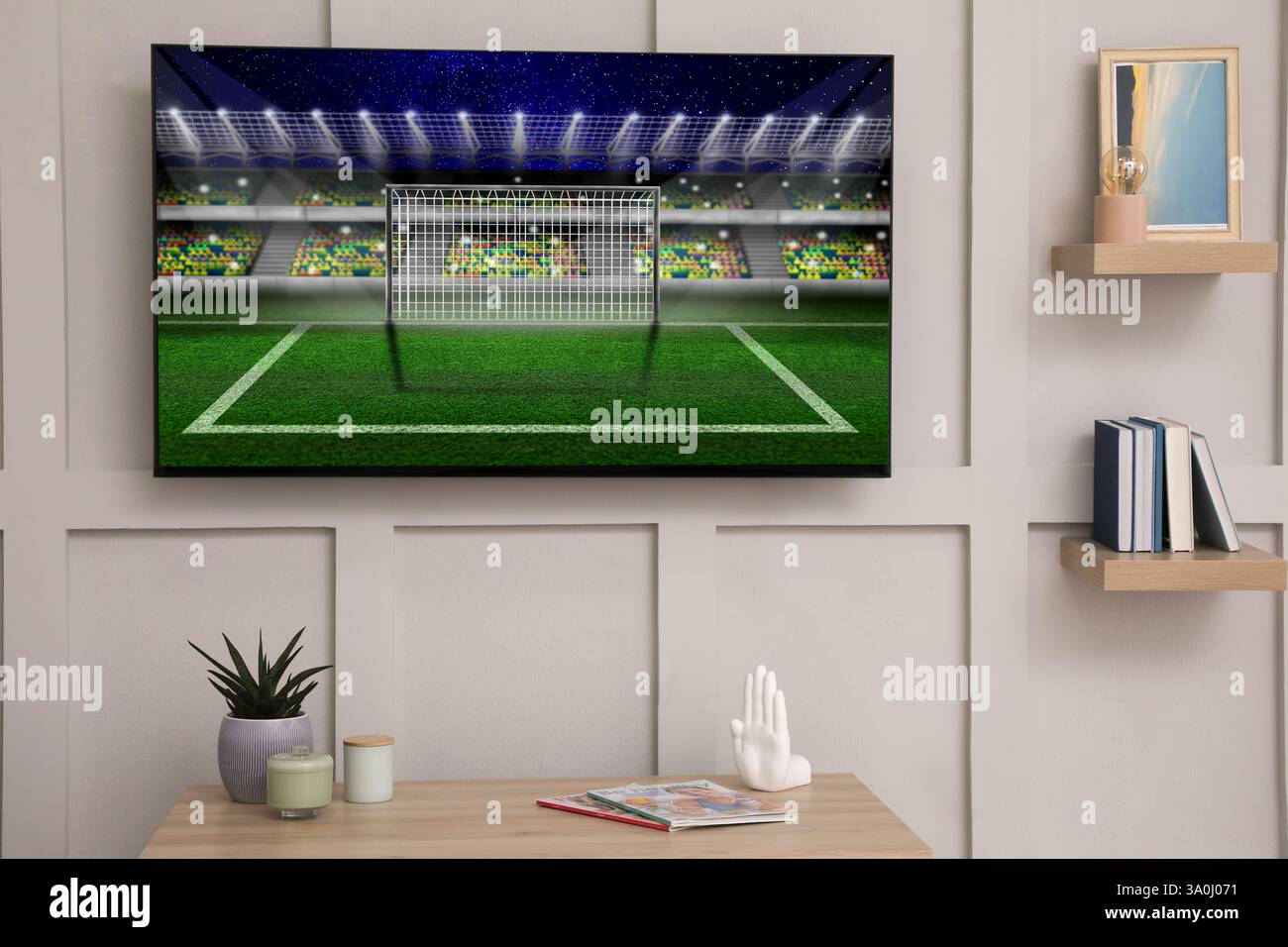 Soccer game playing on TV set in room Stock Photo - Alamy