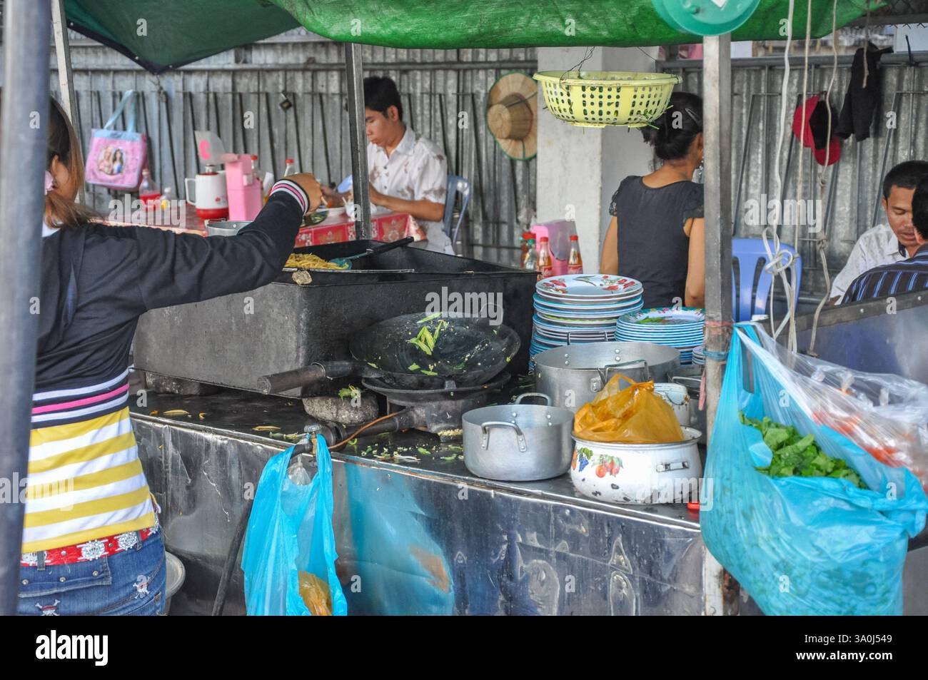 Phnom Penh, Cambodia - May 6, 2009: A bustling street food stall with ...