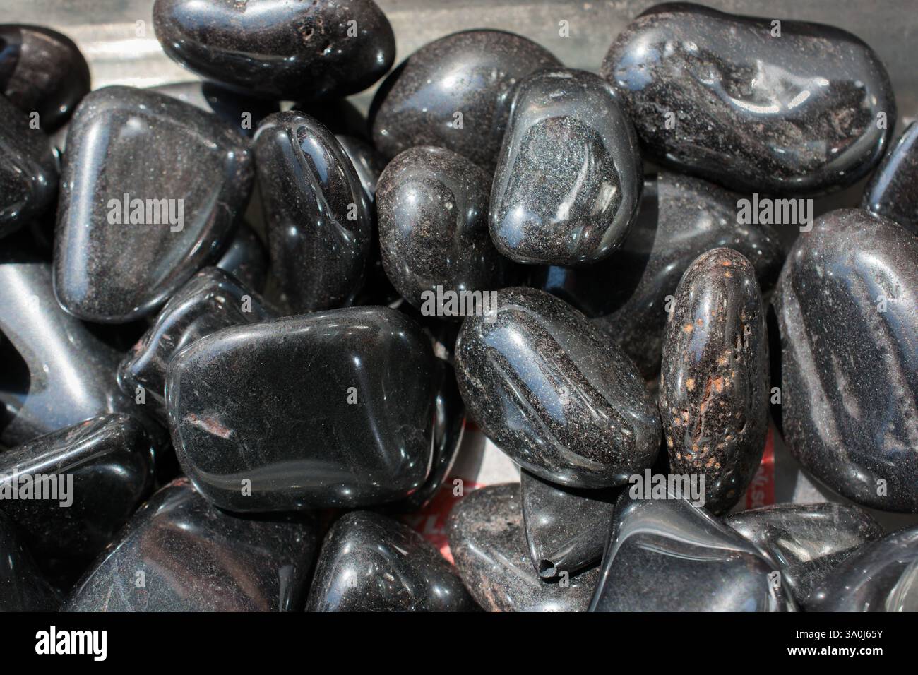 Shiny metallic gray tumbled hematite gemstone as mineral rock Stock ...