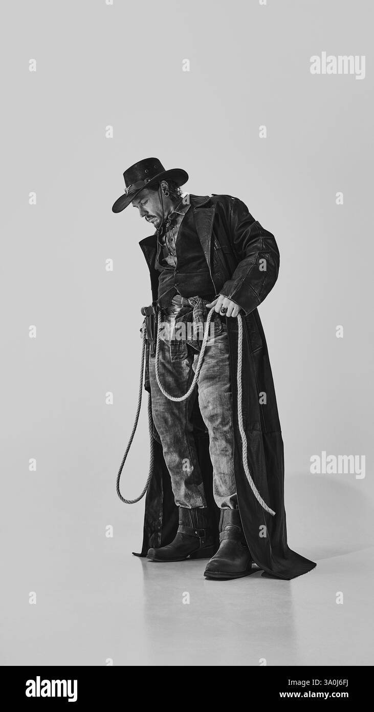 Hat coat and boots Black and White Stock Photos & Images - Alamy