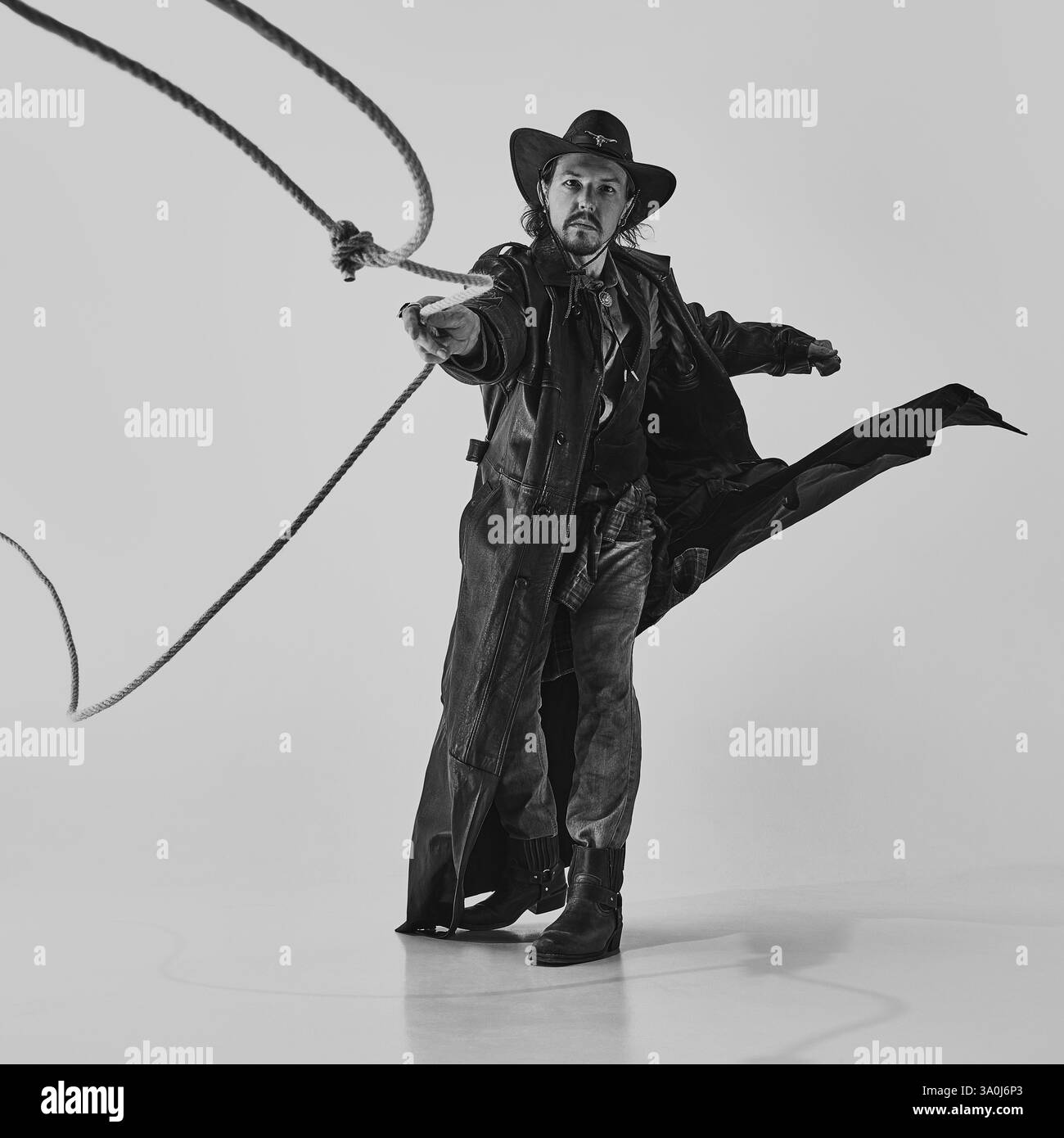 Full-length portrait of American cowboy, dressed in classical wild west ...