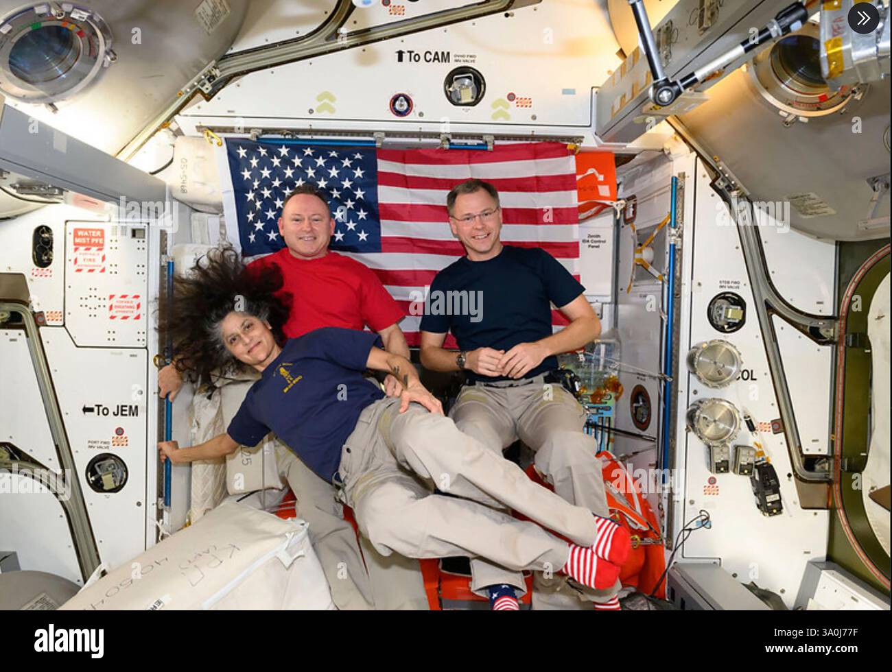 This image provided by NASA shows Nick Hague, right, Suni Williams, and ...