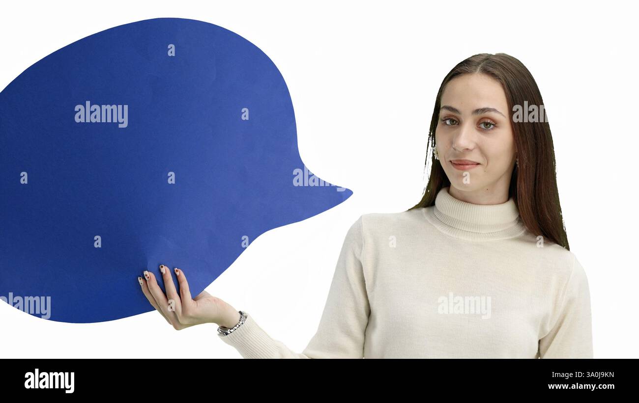 A woman, close-up, on a white background, shows a blue comment sign ...