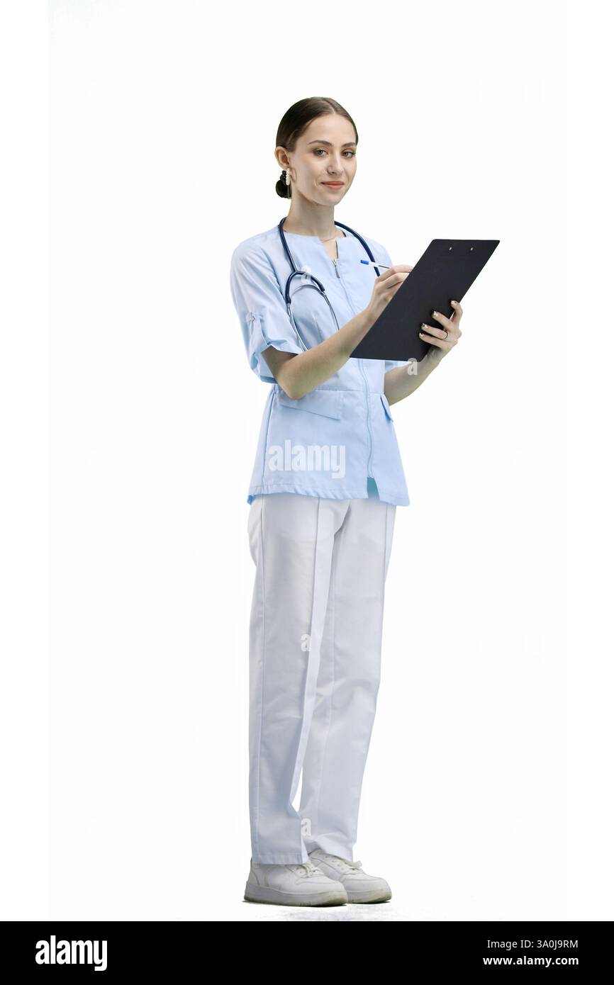 A woman doctor, full-length, on a white background, writes Stock Photo ...