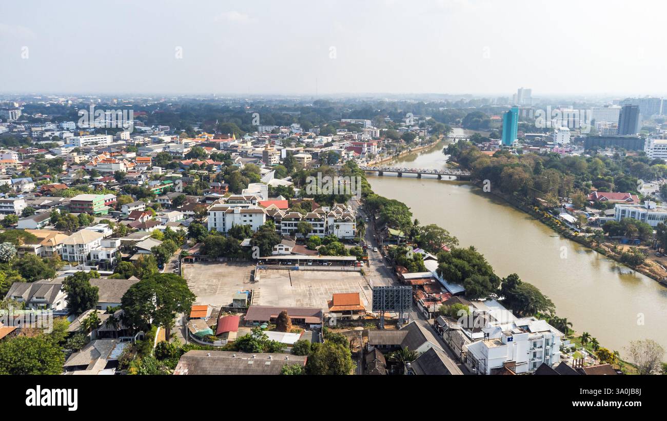 High-angle view of Chiang Mai's cityscape featuring the Ping River ...