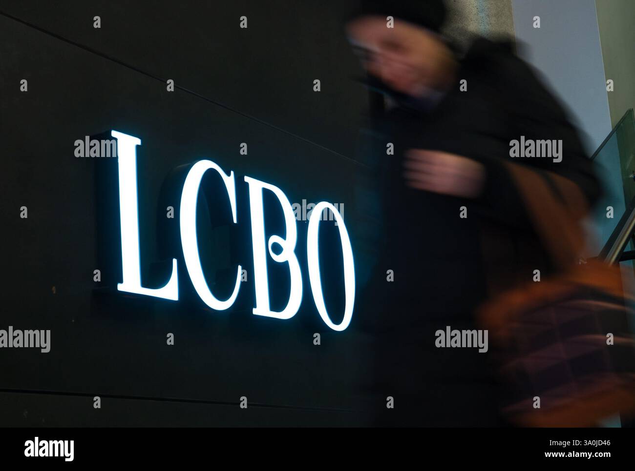 Toronto, Canada. 04th Mar, 2025. A person walks by an LCBO outlet in ...