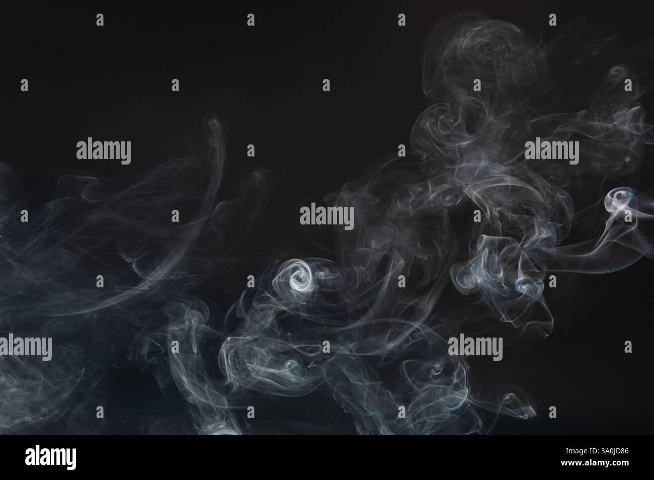 Smoke effect curve lines flow isolated on black studio background Stock ...