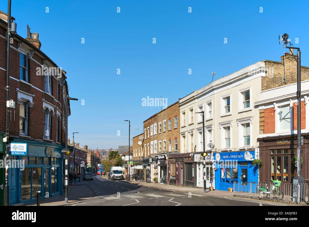 Park Road, Crouch End, London UK, with shops and pedestrians Stock ...