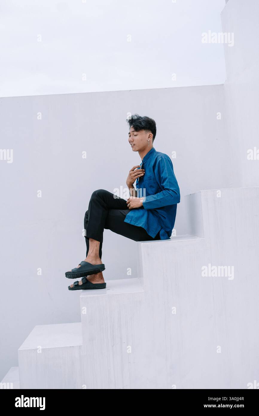 Thoughtful man in blue hi-res stock photography and images - Alamy