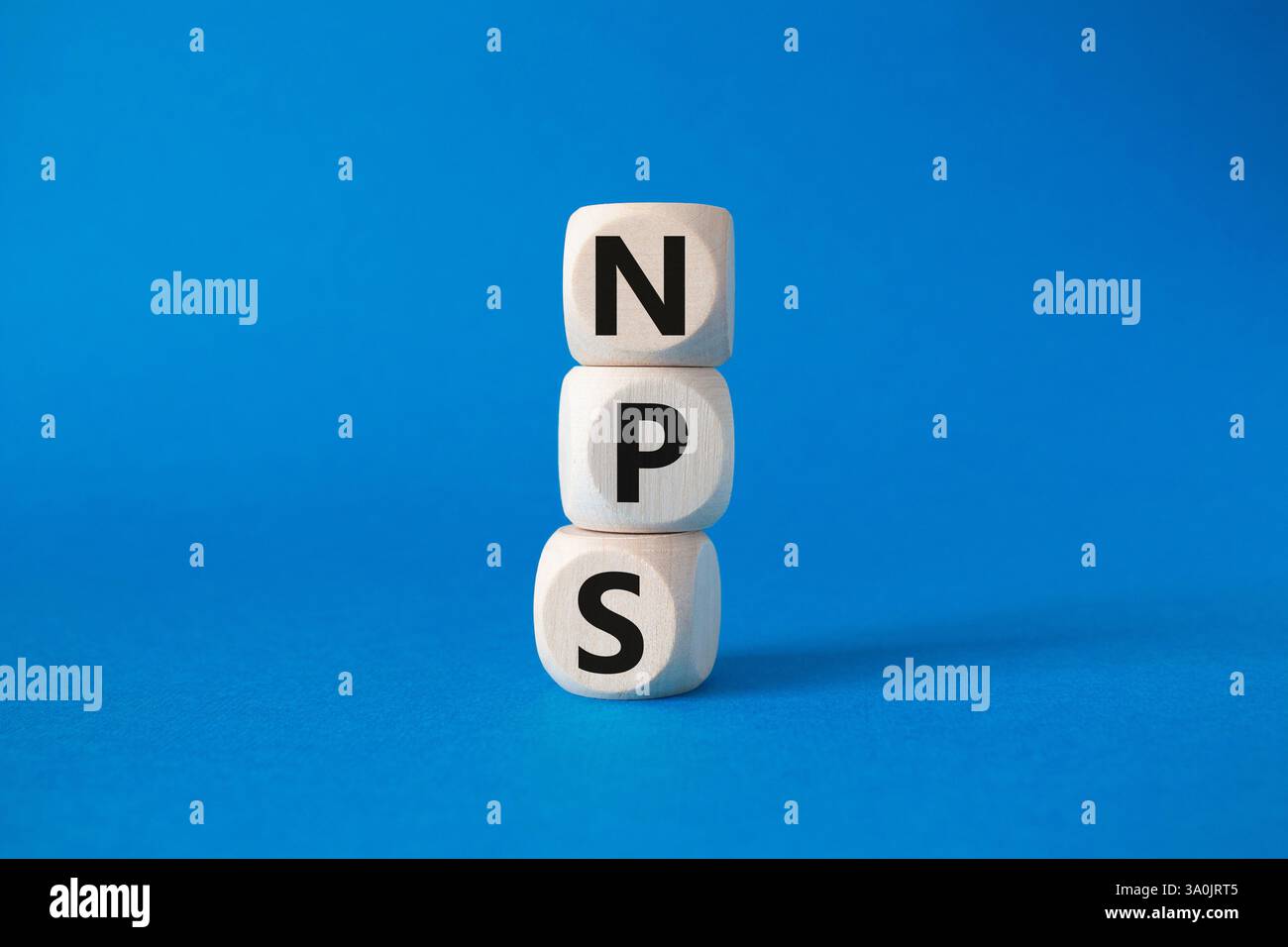 NPS - Net Promoter Score symbol. Wooden cubes with words NPS. Beautiful ...