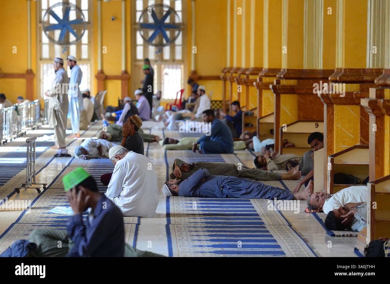 Faithful Muslims take nap and rest at New Memon Mosque during the Holy ...