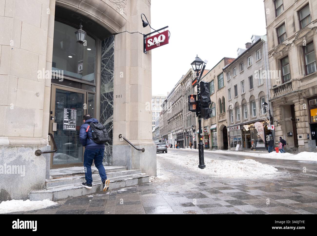 Montreal, Canada. 04th Mar, 2025. A person walks into a SAQ liquor ...