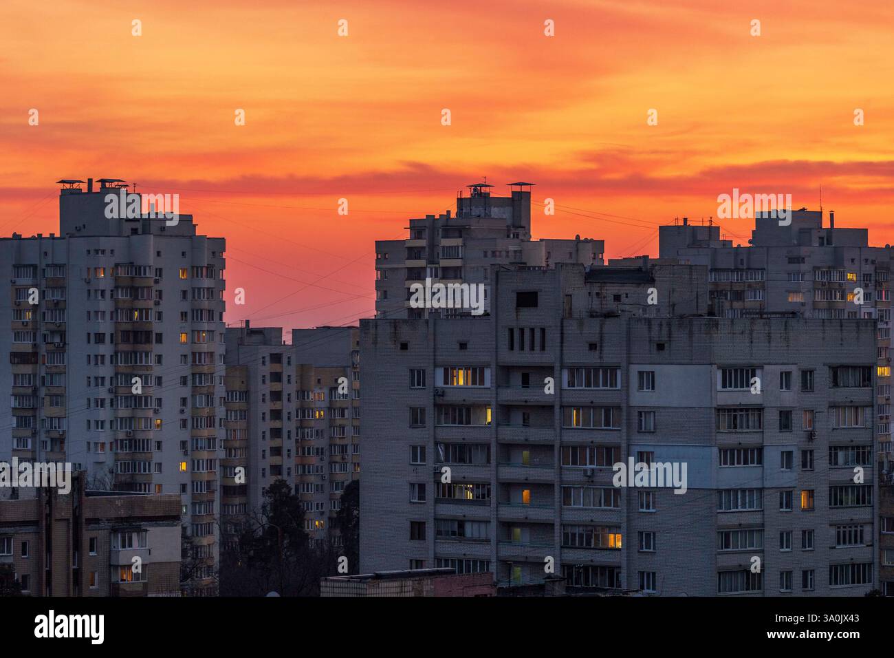 Beautiful sunset behind high-rise buildings of Kyiv Stock Photo - Alamy