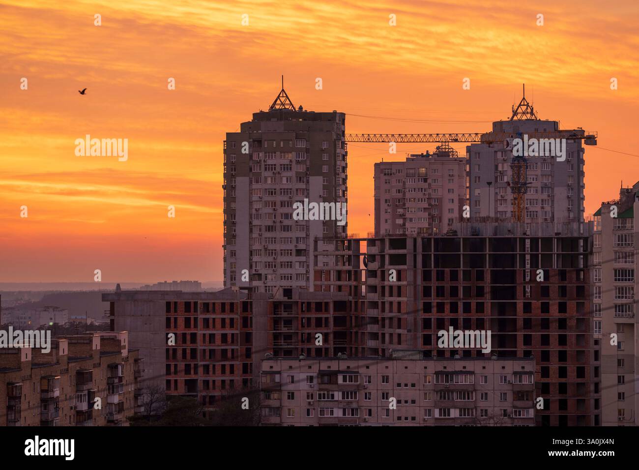 Beautiful sunset behind high-rise buildings of Kyiv Stock Photo - Alamy