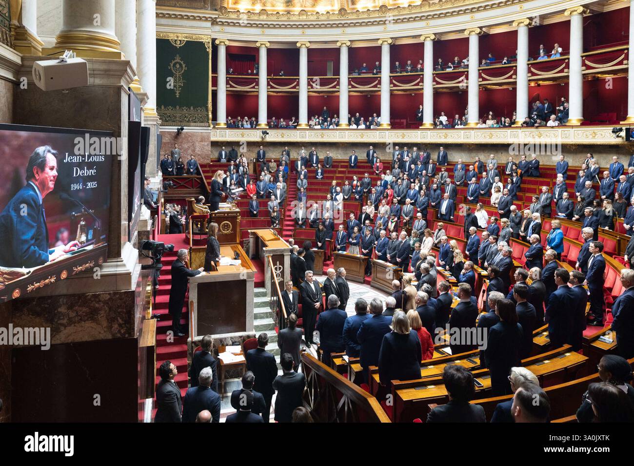 Paris, France. 04th Mar, 2025. French MPs stand in the parliament in ...