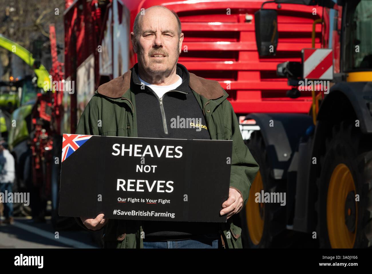London, UK. 4 March, 2025. A man holds a placard saying "Sheaves Not ...