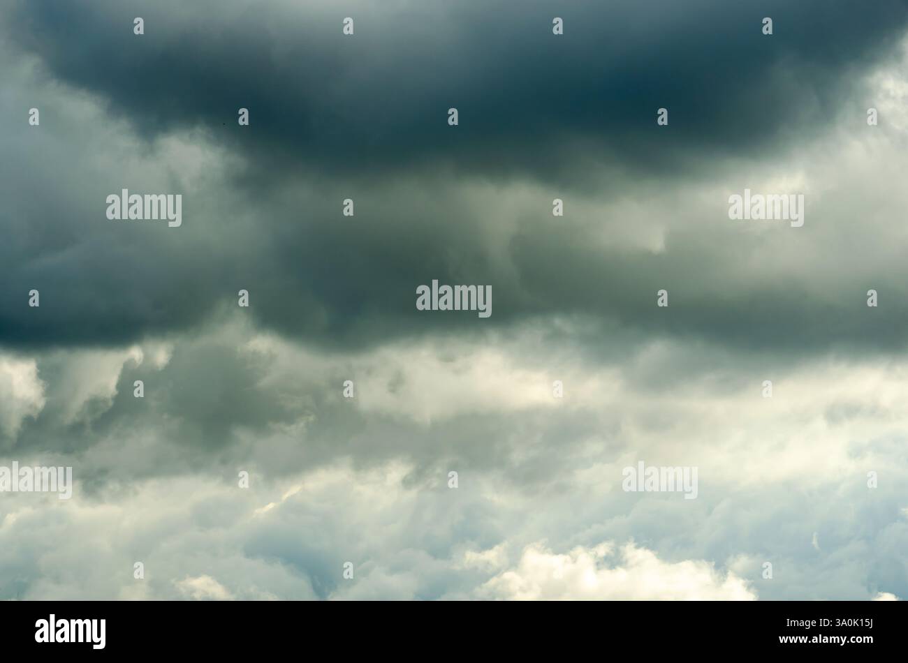 Layers of light and dark moody clouds in the sky Stock Photo - Alamy