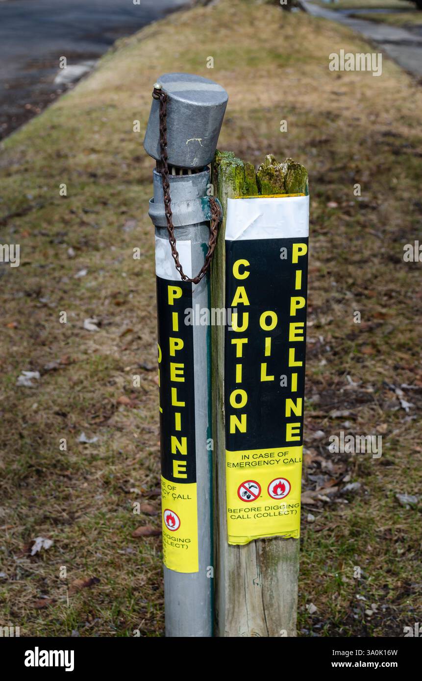 Underground Oil pipeline marker next to a residential street Stock ...