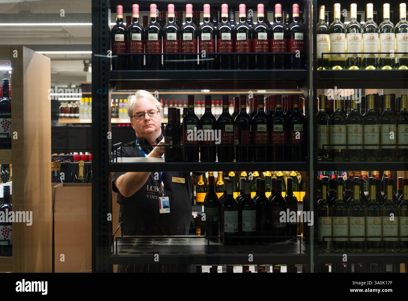 Toronto, Canada. 04th Mar, 2025. An LCBO employee moves products in an ...