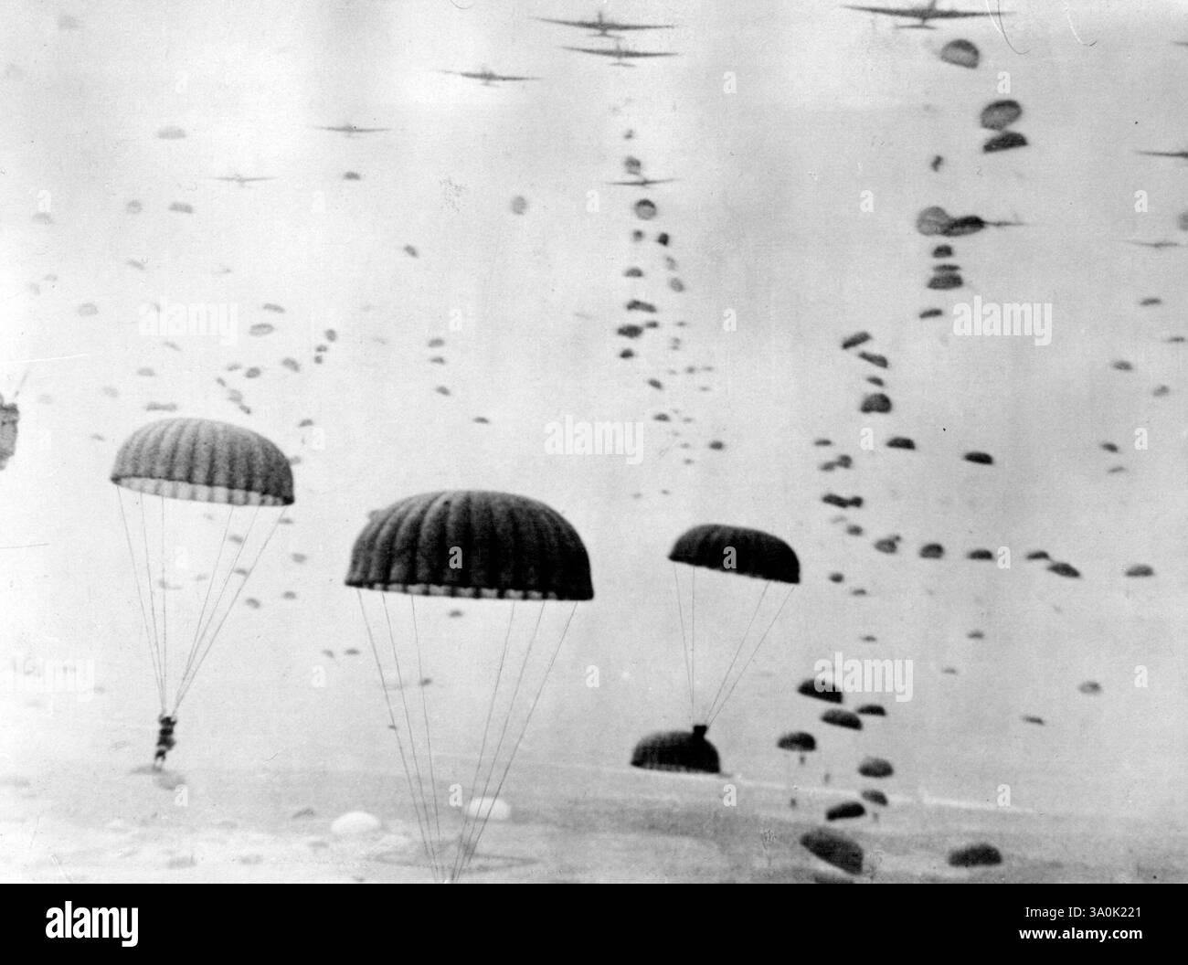 Parachutes open overhead as waves of paratroops land in Holland during ...