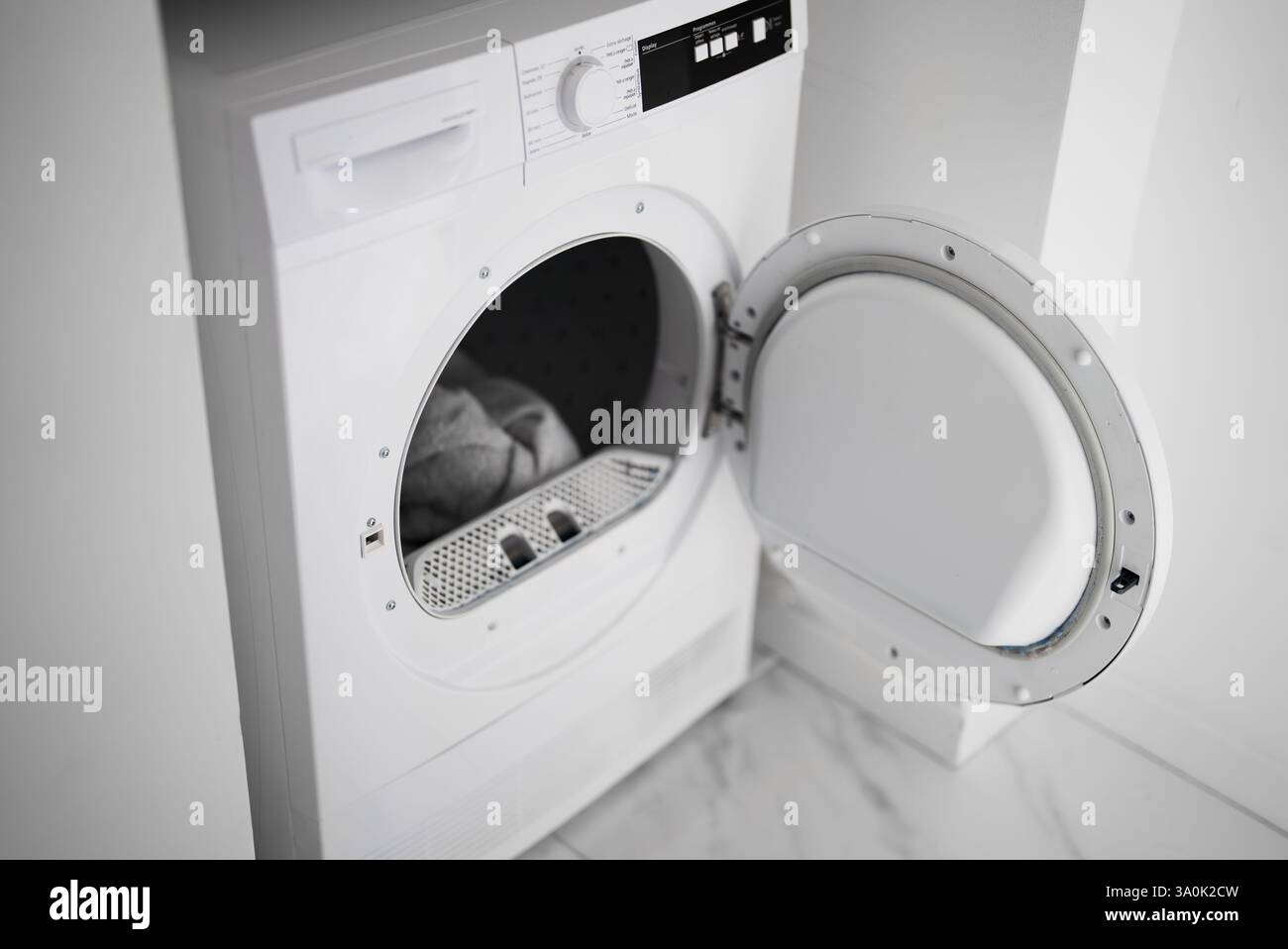 Clothes spin in washing machine hi-res stock photography and images - Alamy