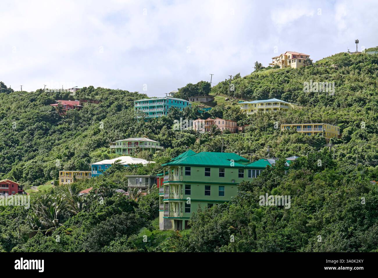 hillside buildings, pastel colors, mountain, green vegetation ...