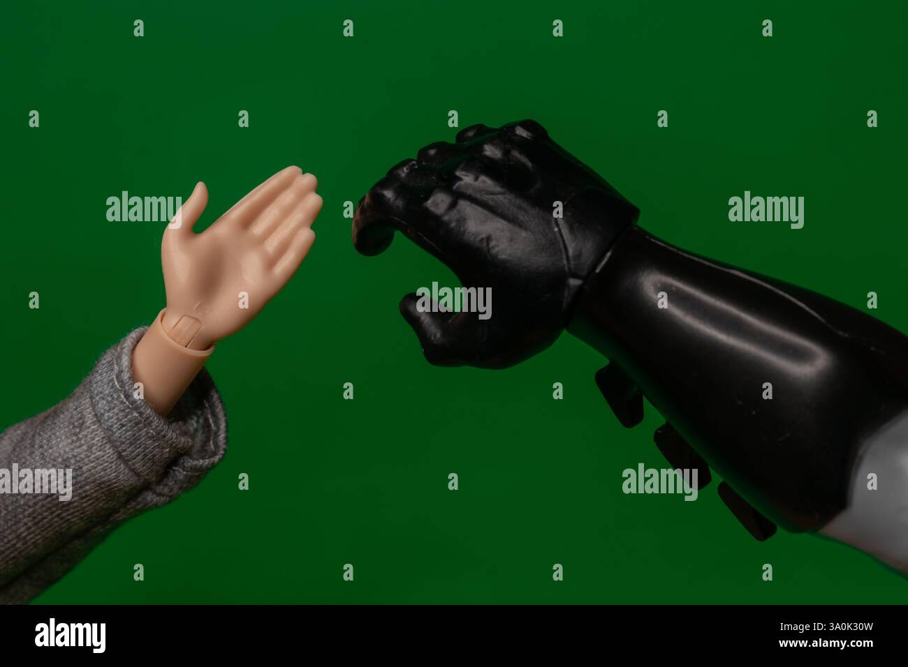 Human and robot hand isolated on green background with copy space Stock ...