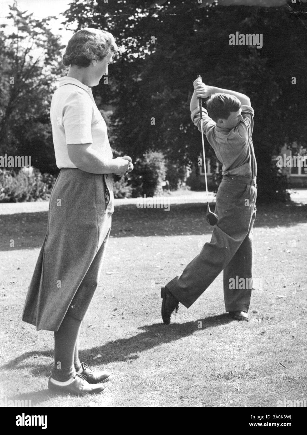 Golf: Photo Shows: John Beharrell, aged 13, drives off, watched by his ...