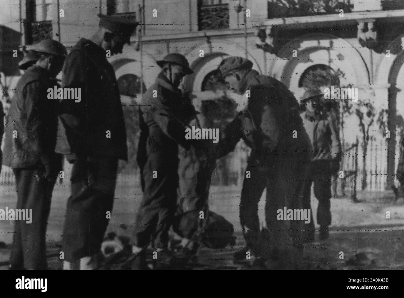 British troops removing dynamite discovered in a sewer in front of the ...