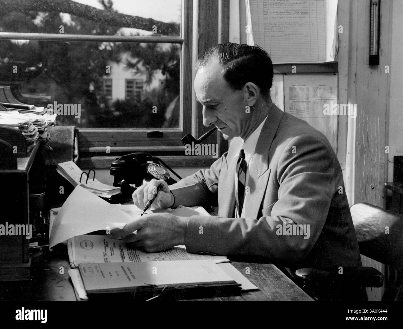 Lt. Commander Batterham at his desk at the Naval Barracks at Albert ...