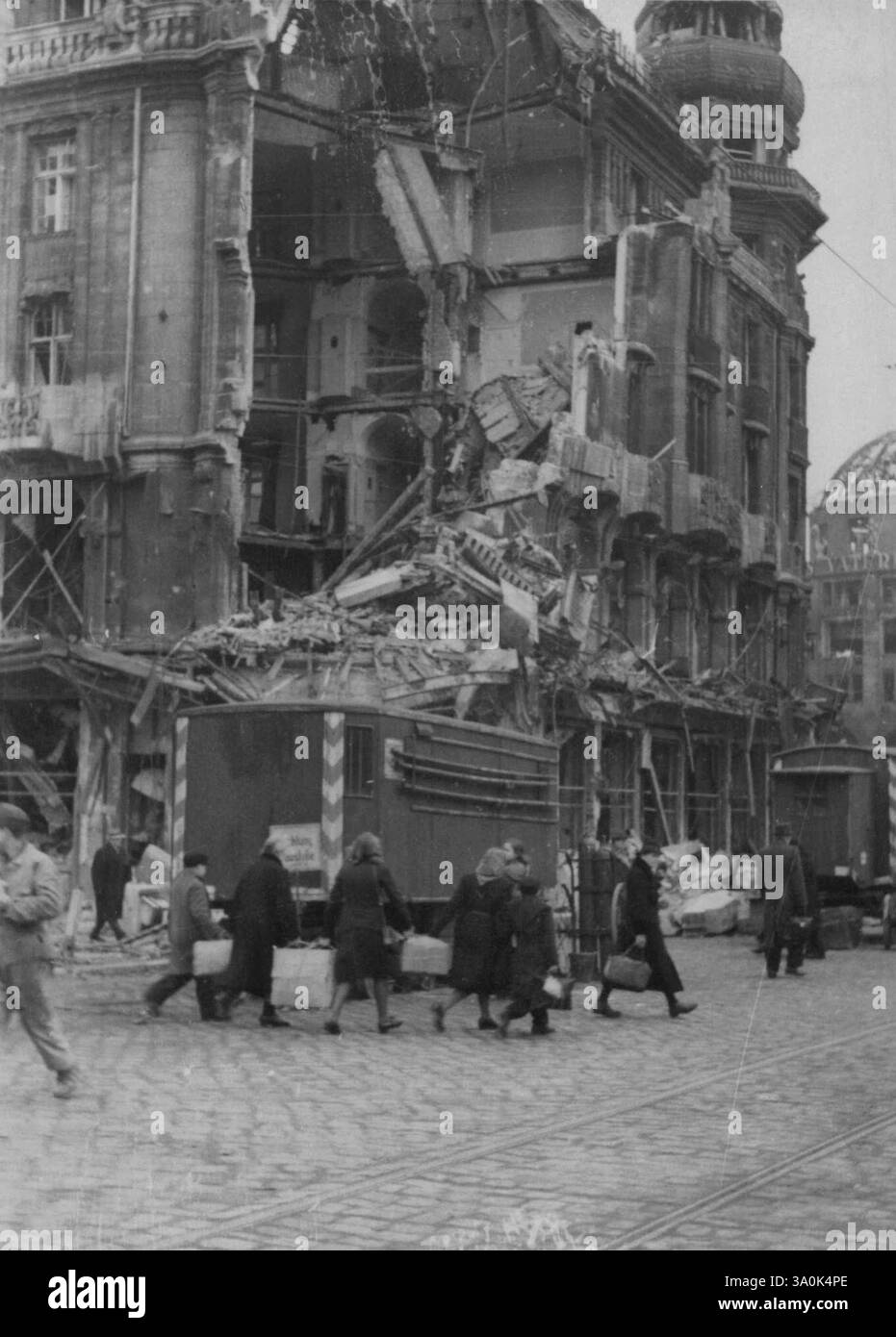 On Way To Shelter -- Berliners walk past the bomb-damage Hotel ...