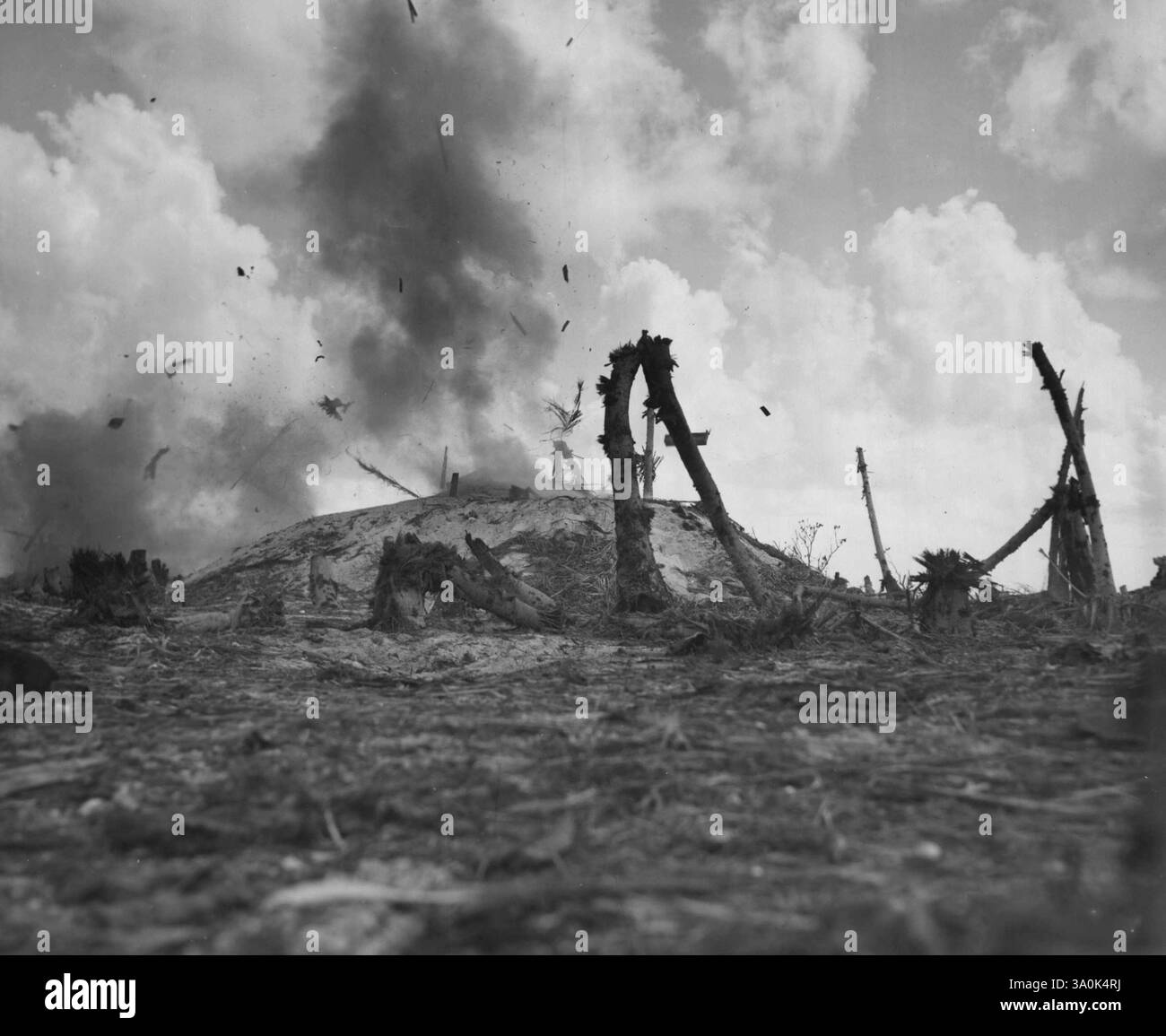 Dynamiting Snipers on Tarawa -- Smoke and debris fly into the air as ...